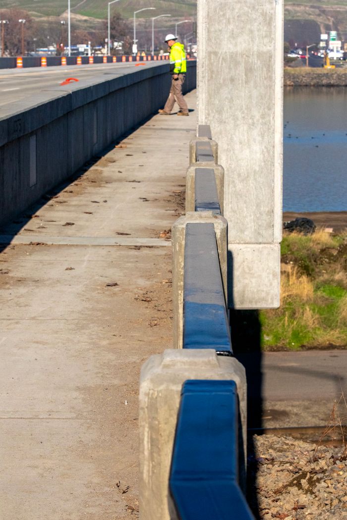 Work on Memorial Bridge pedestrian railing continues