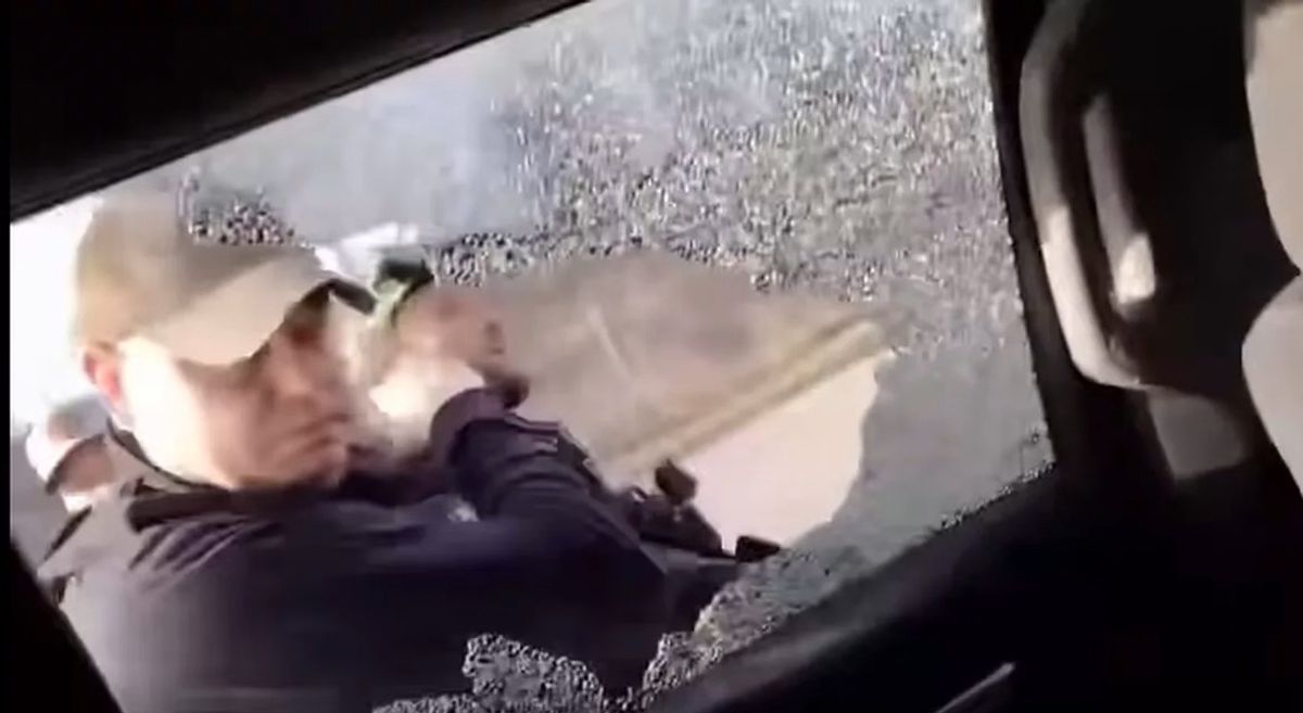 ICE agents smash windows of vehicle, drag two people out in front of p...