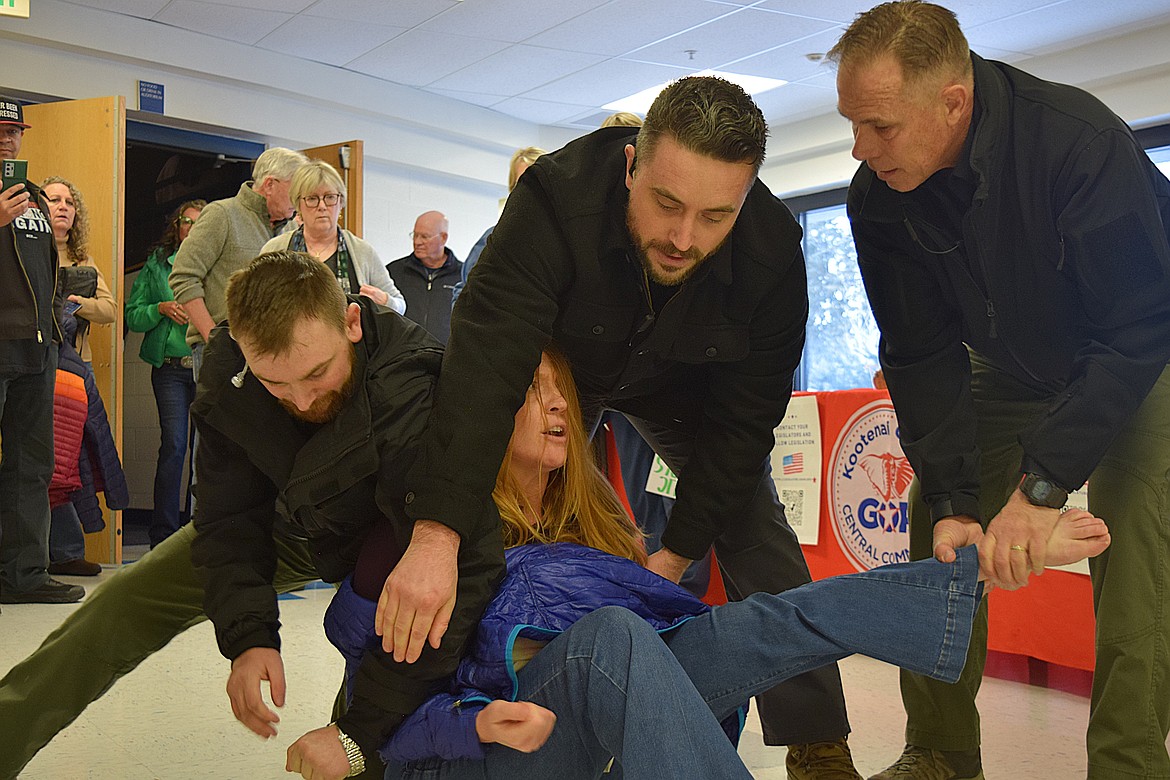 Coeur d'Alene town hall gets chaotic, with security guards dragging wo...