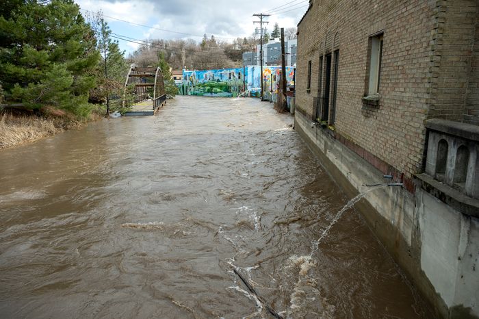 Heavy rain triggers flooding Saturday