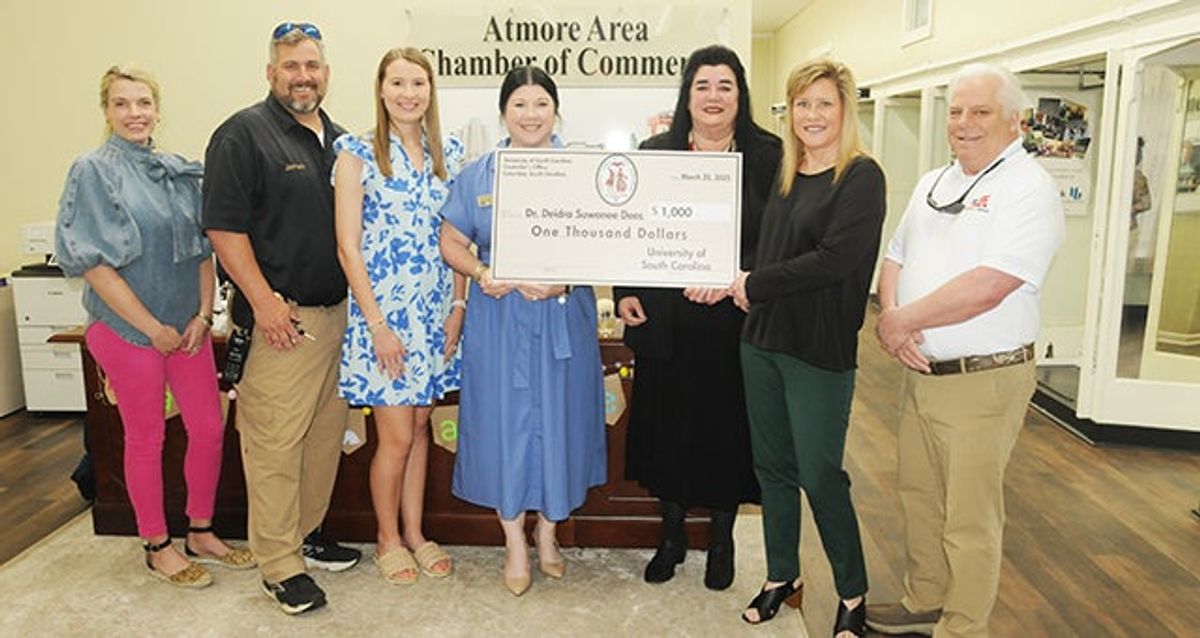 PCI treasurer, Dees present check to Youth Leadership Atmore program M...