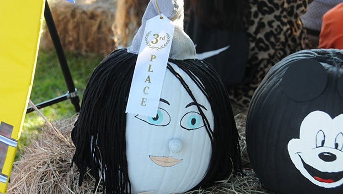 APL holding Pumpkin Decorating Contest