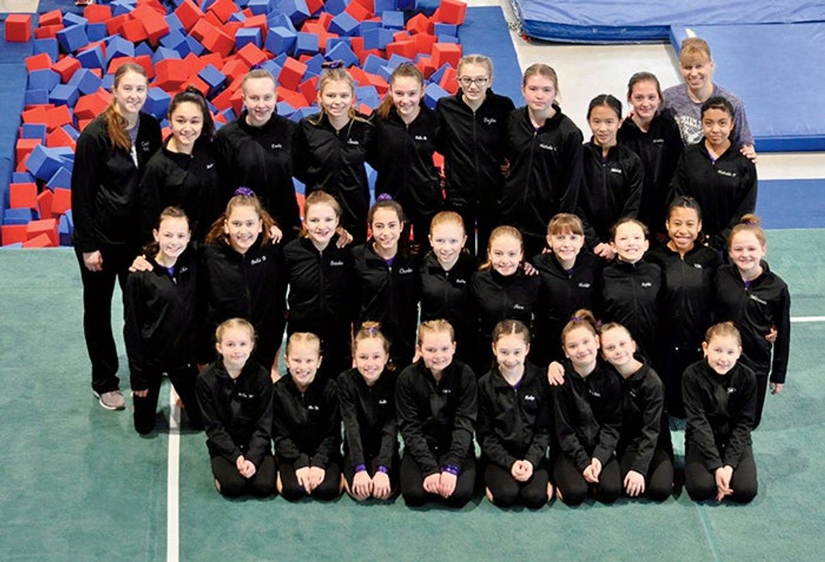 YMCA gymnasts open new facility with a meet