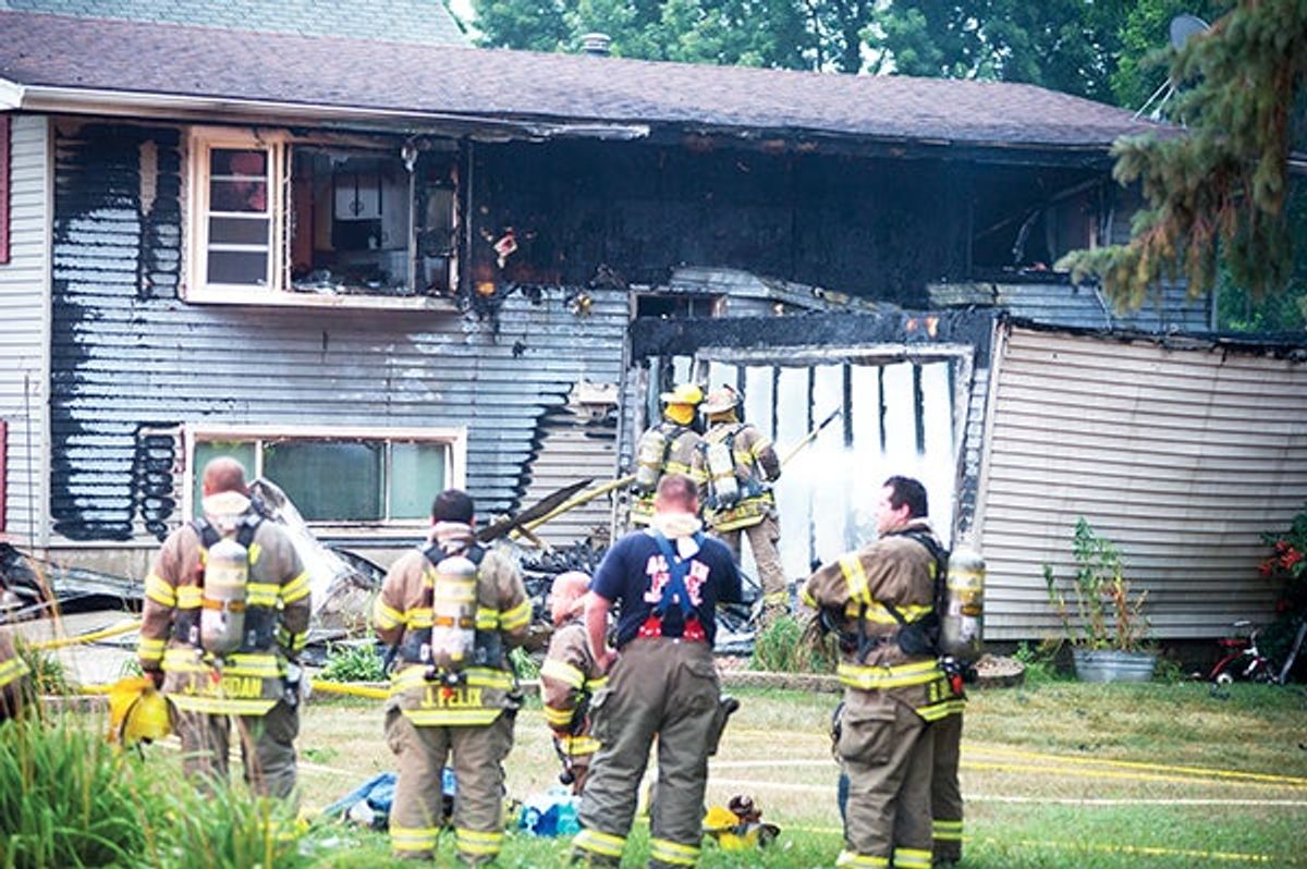 Garage destroyed, house damaged in morning fire