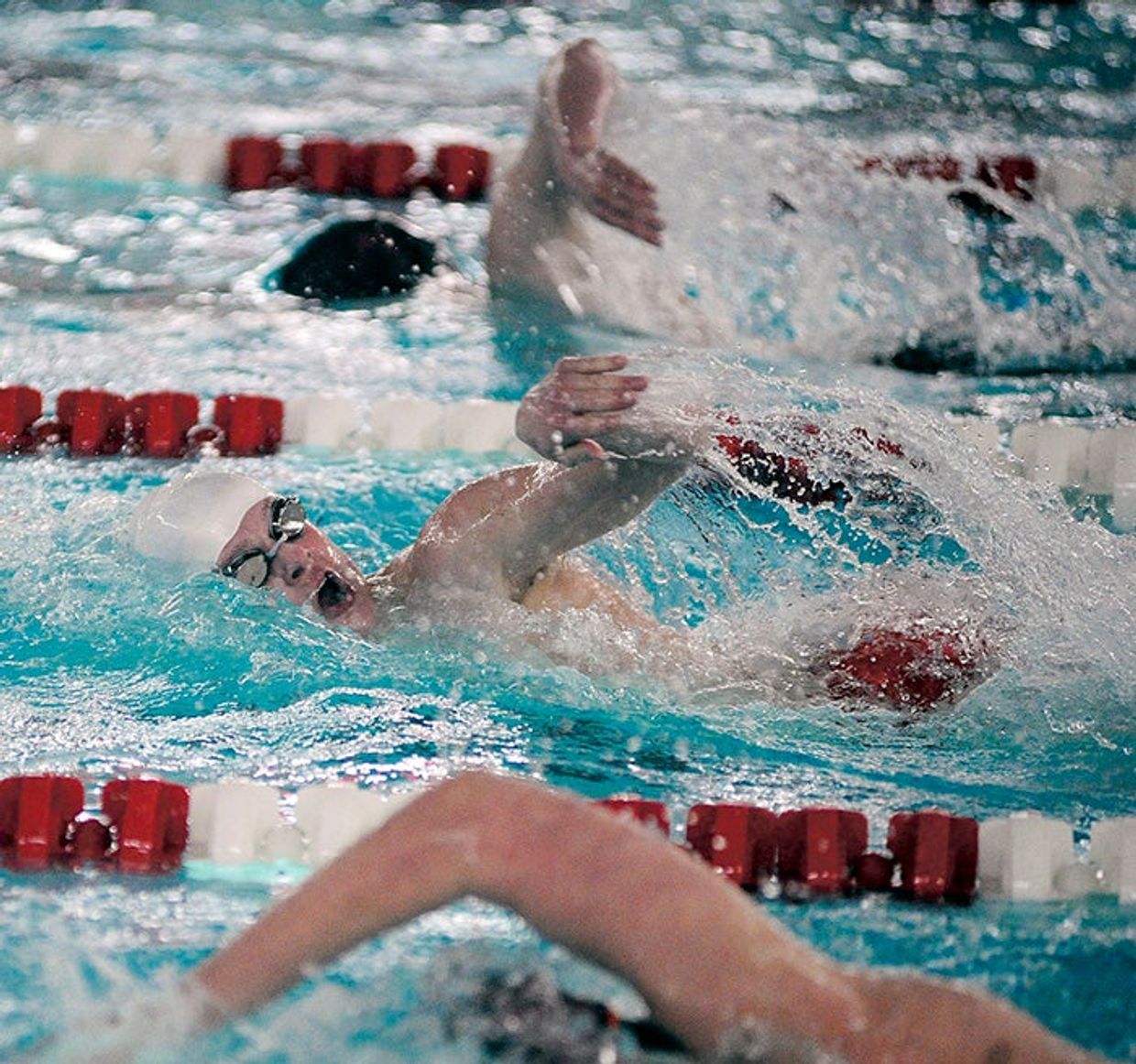 Packer swimmers edged out by Raiders