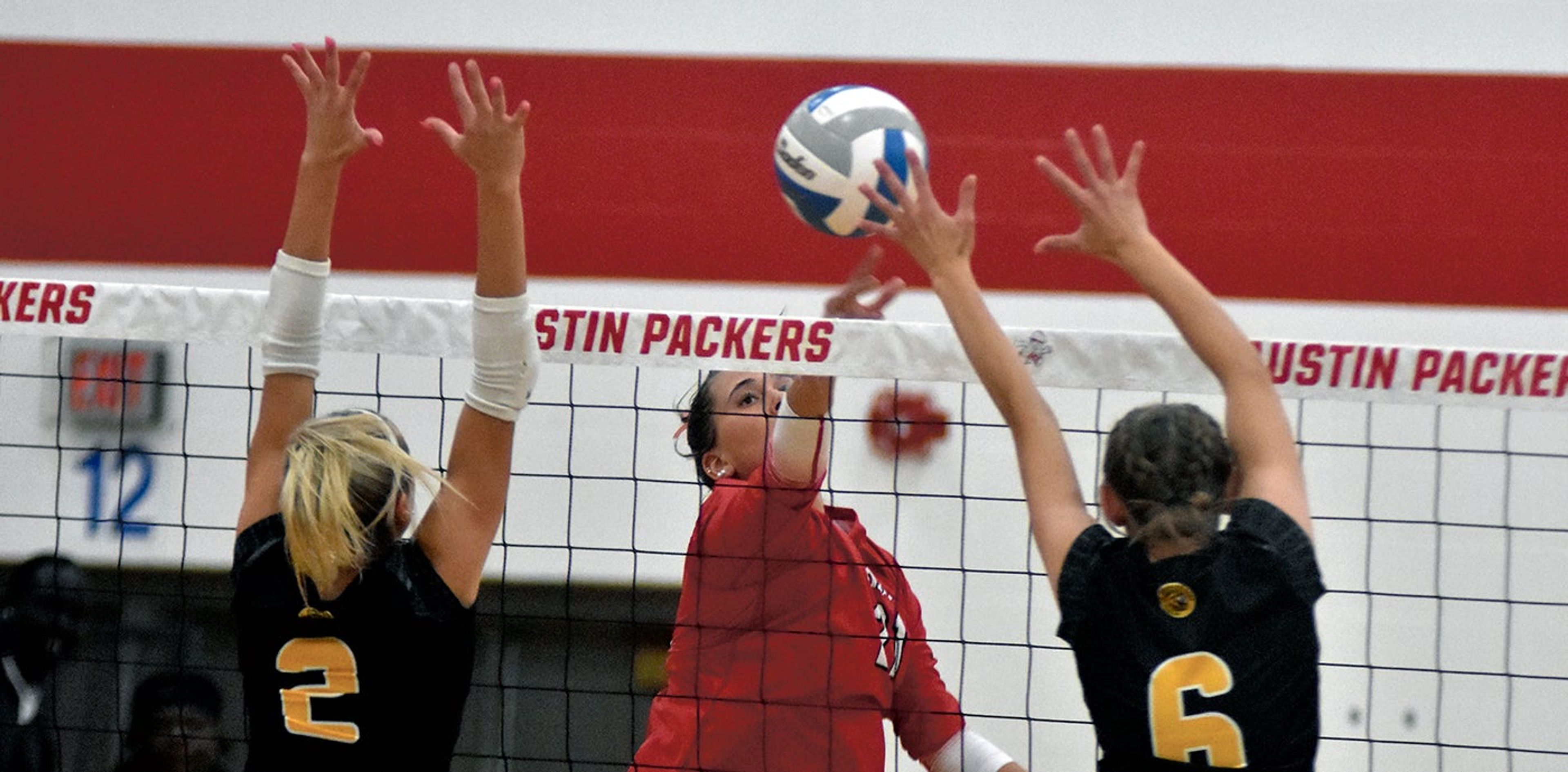 Cougars outlast Packer volleyball team in four games