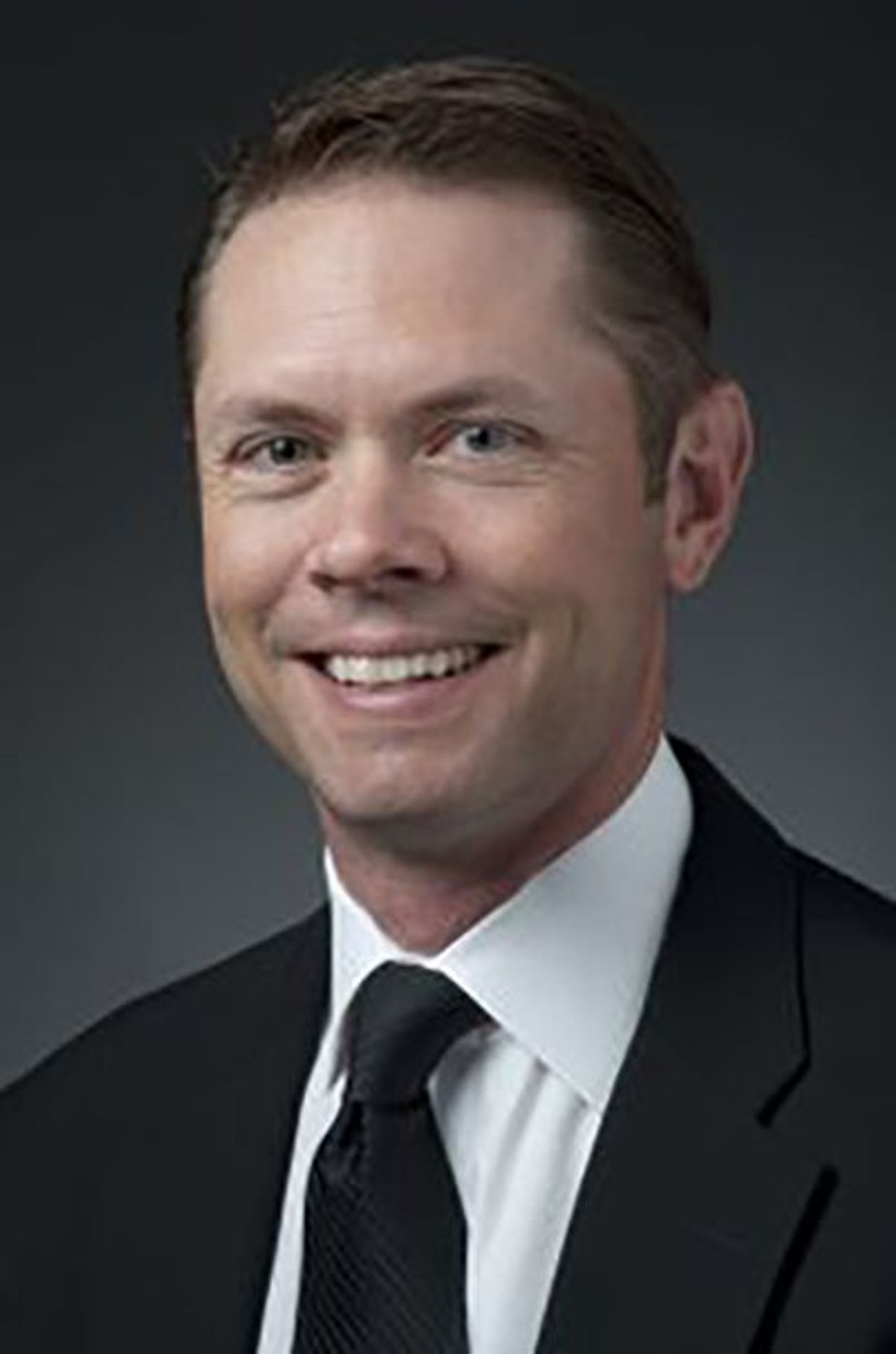 Austin grad elevated to division president