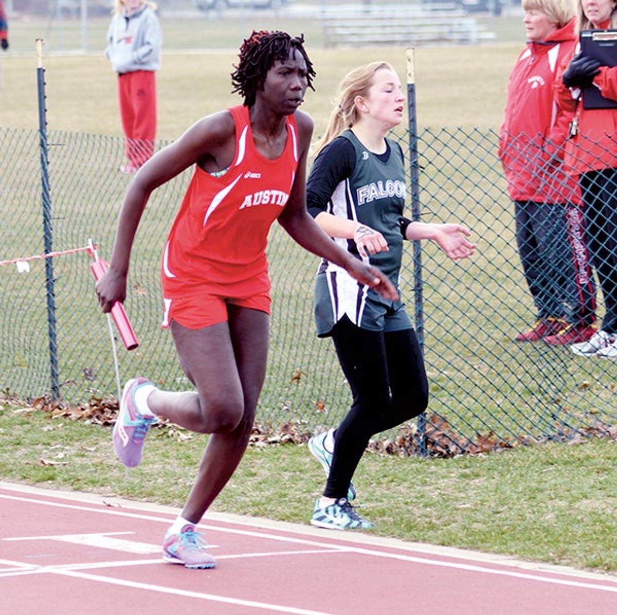 Packer girls win home track and field invite