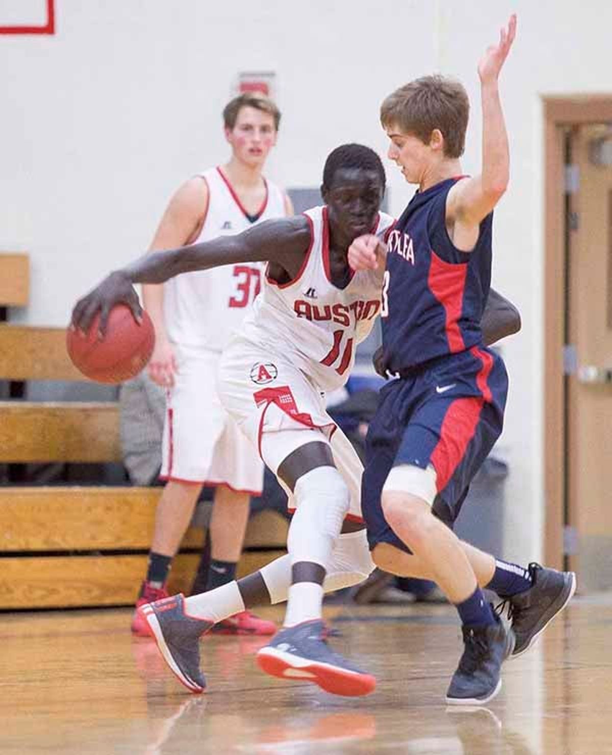 Austin boys basketball team cruises past Tigers