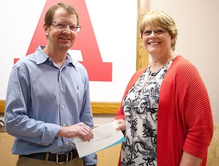 A generous gift: Overby Orthodontics wipes out APS lunch debt with $12...