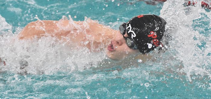 Packer swimmers fall to Cougars
