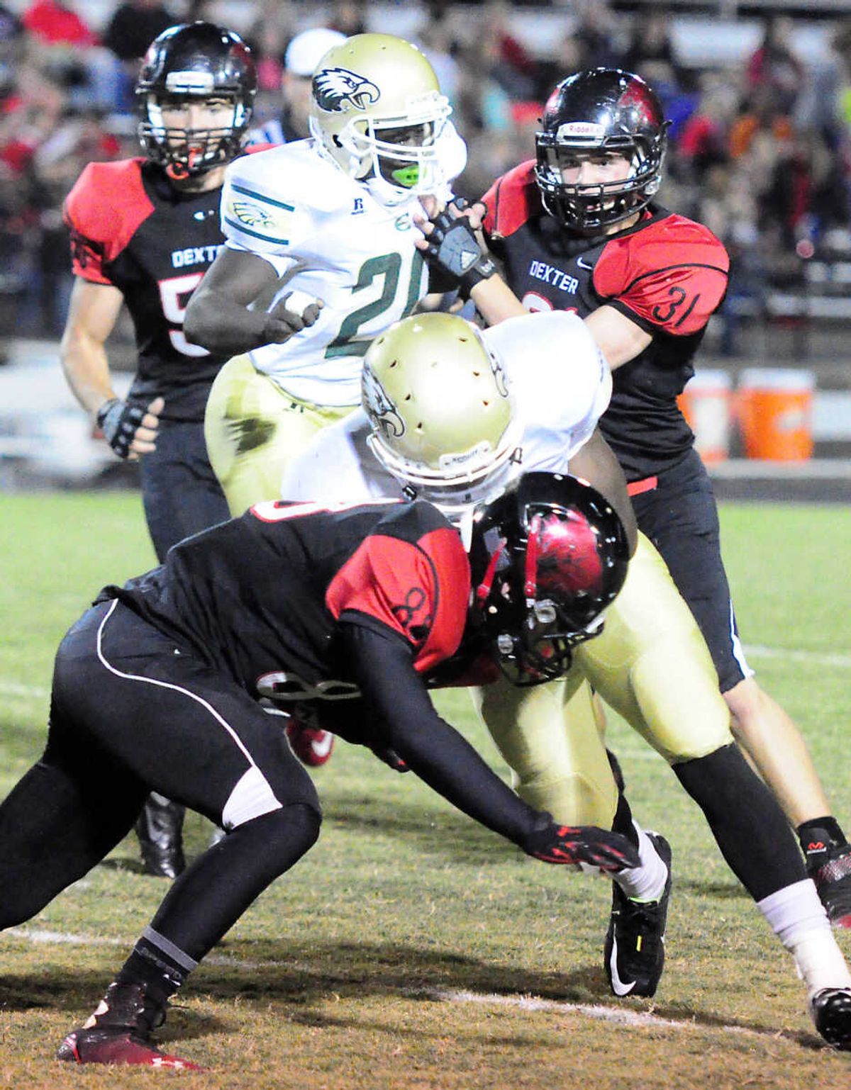 Dexter football team secures share of conference title, routs NMCC 62-...