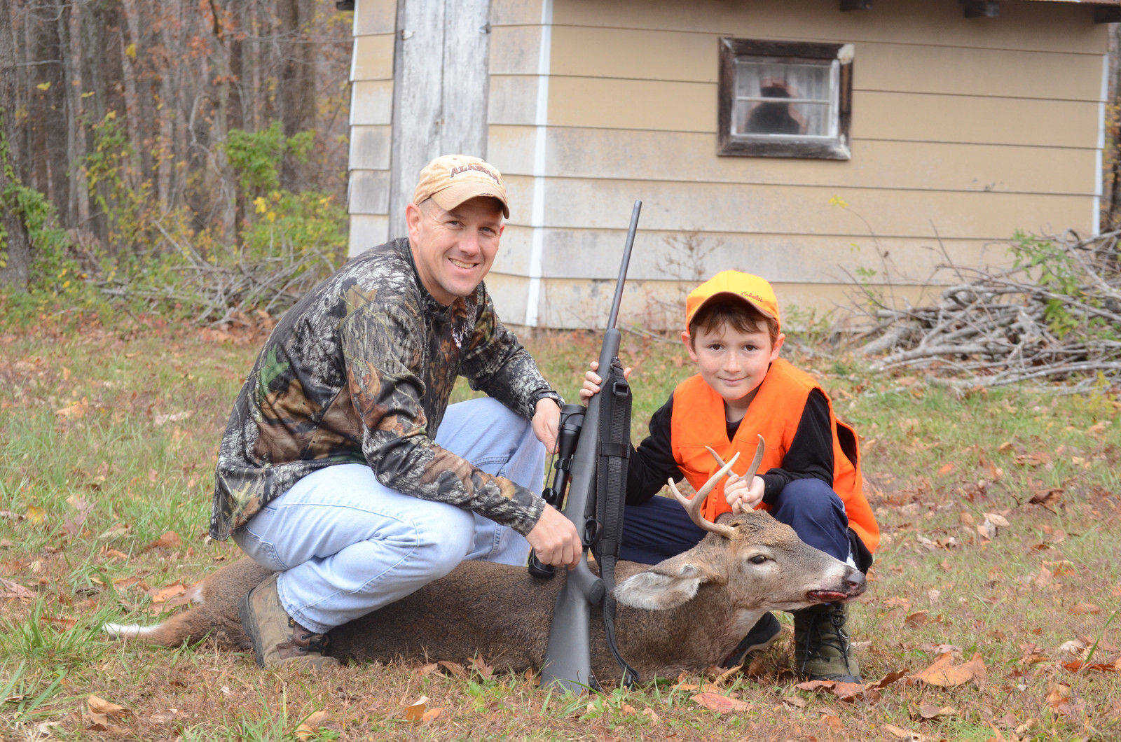 Father and son share similar first deer kill