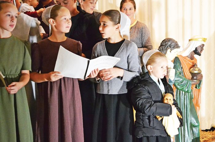 Dexter Christmas Reading draws crowd indoors with carols, cookies, and...