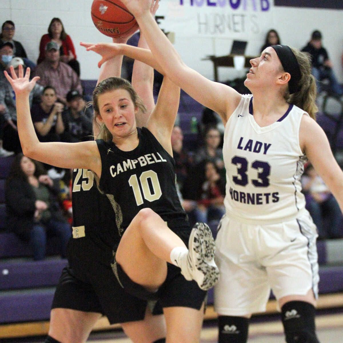 Holcomb girls basketball remains perfect in conference play, hands Cam...