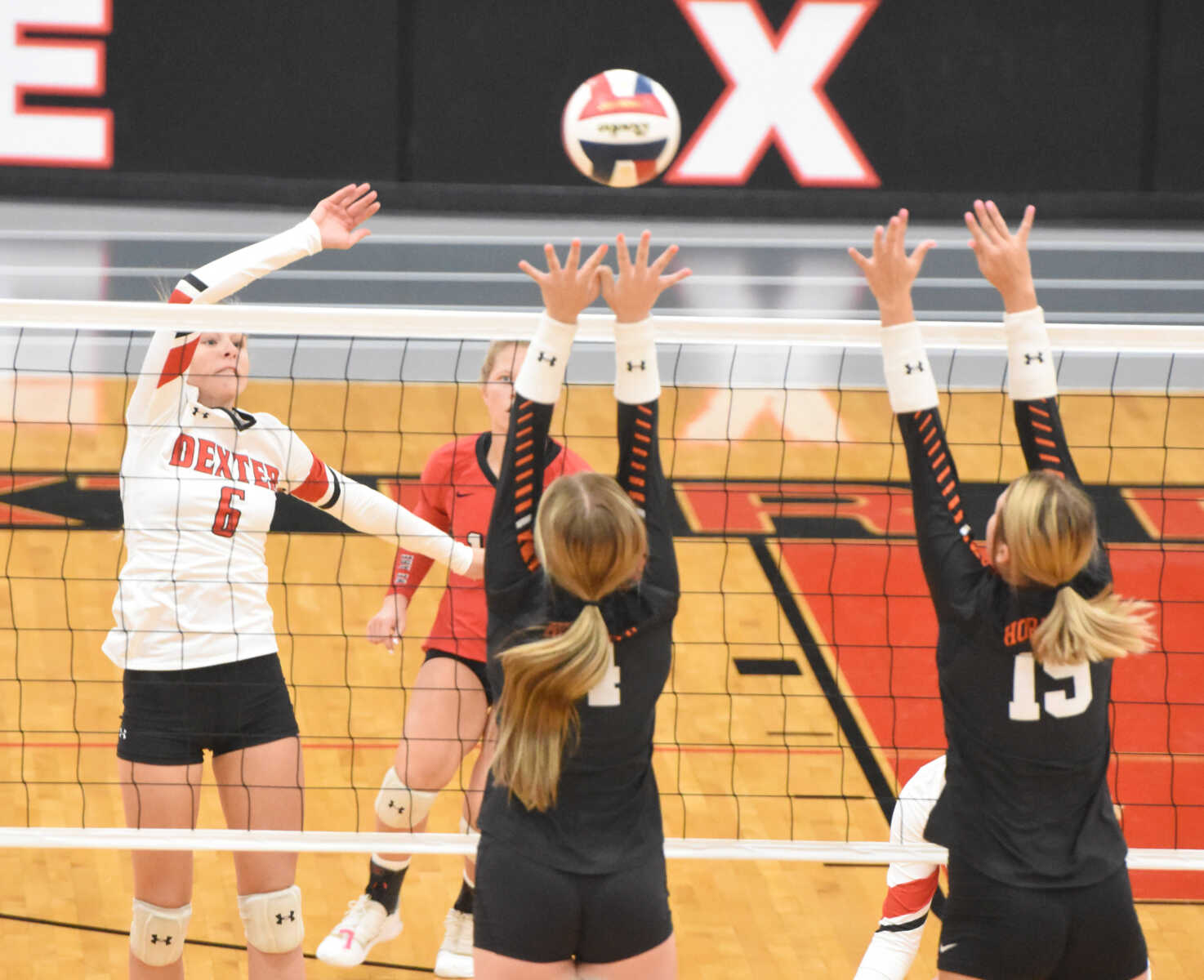 Dexter volleyball snaps losing streak to three-time state champion, be...