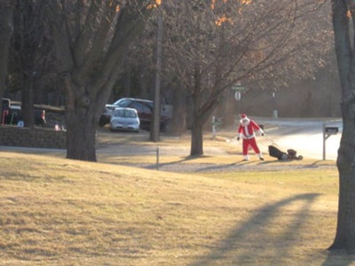 Santa seen mowing his lawn