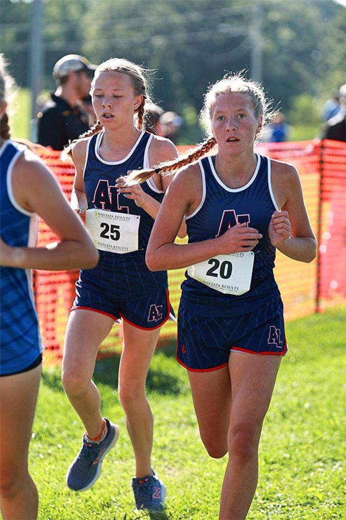 Albert Lea's Hanke wins first home meet of season