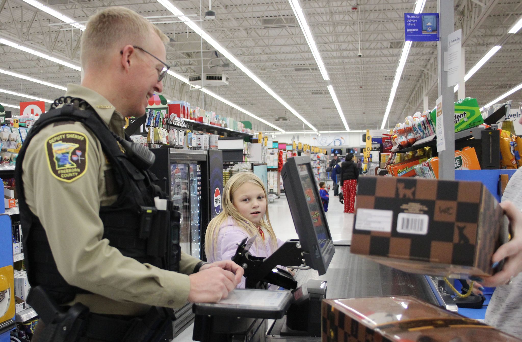 Law enforcement and families return to participate in Shop with a Cop ...
