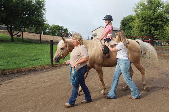 A powerful intervention: Woman offering hippotherapy among more tradit...