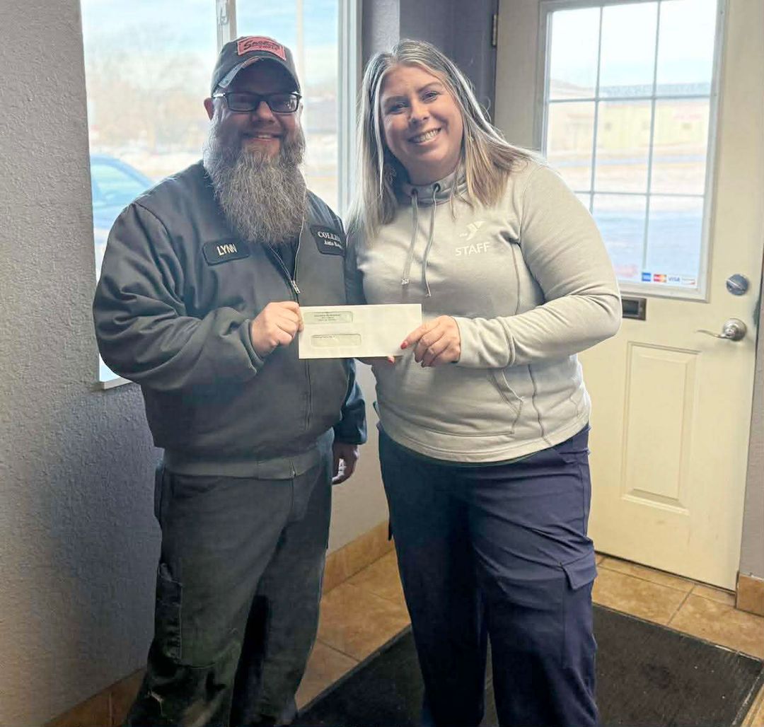 Collins Auto doubles 'Change for Change' donation to YMCA