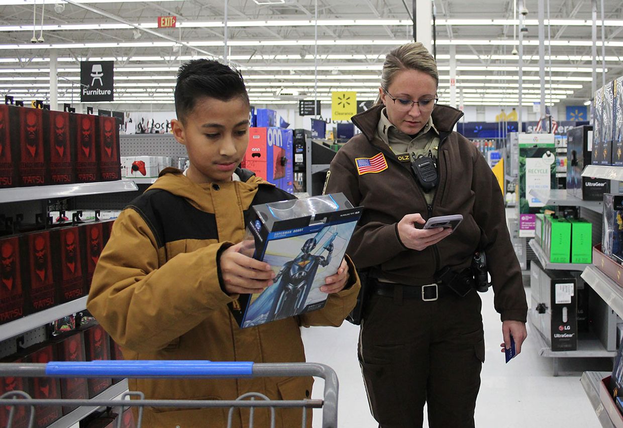Law enforcement and families return to participate in Shop with a Cop ...
