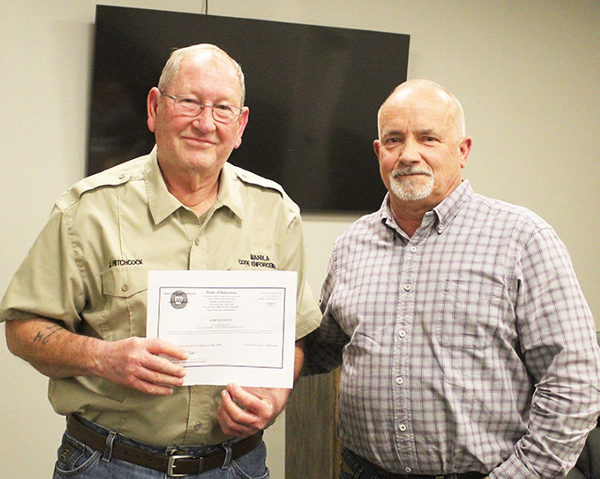 Manila honors code enforcement officer Jerry Hitchcock