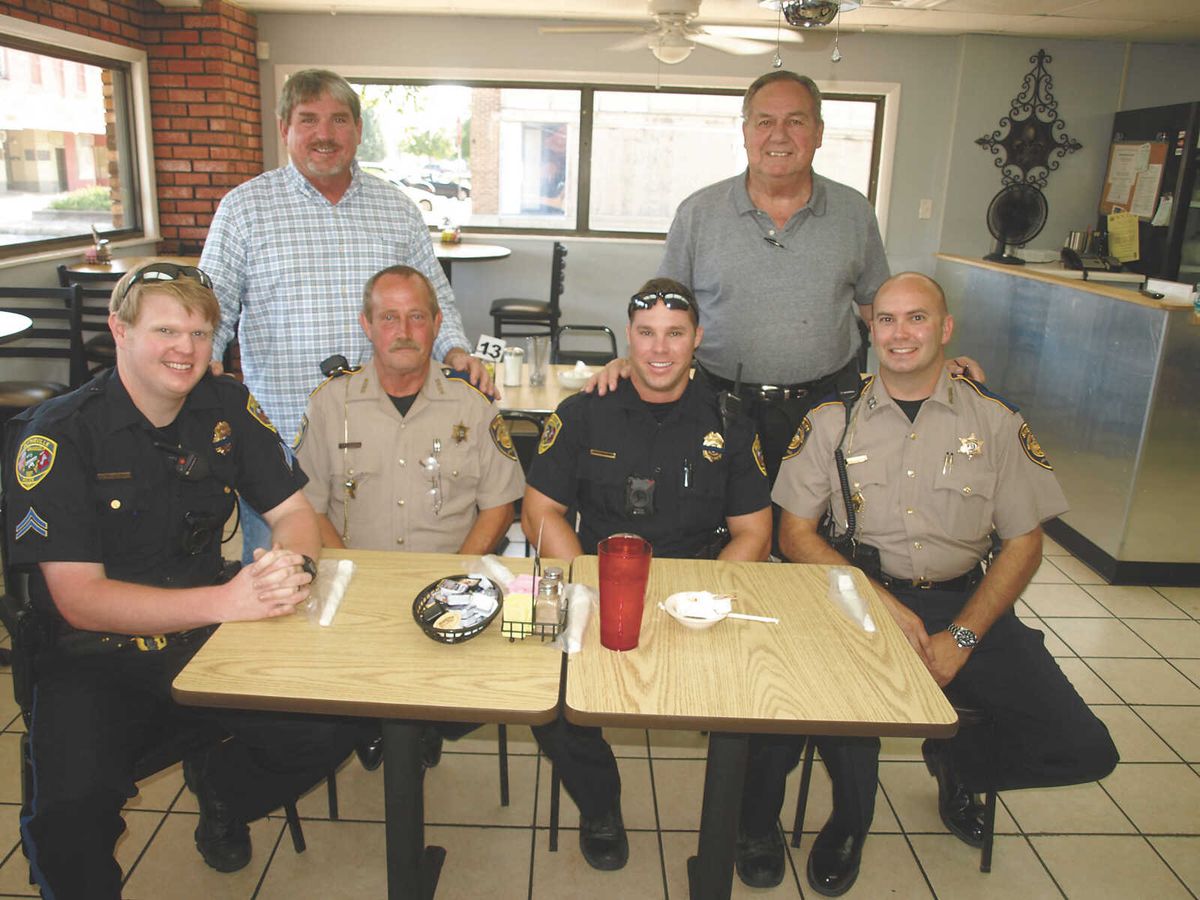 Russell buying breakfast for police officers