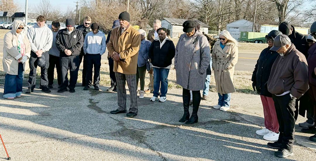 Worshipers line Highway 18, from Blytheville to Jonesboro, to pray for...
