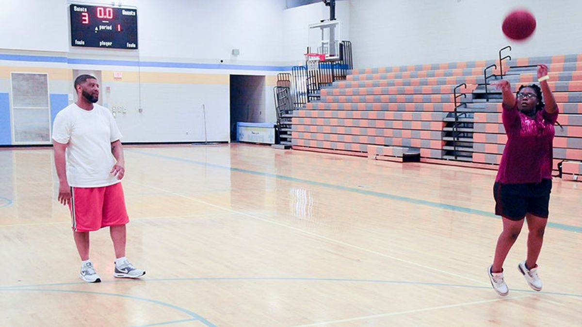Local legend Doc Robinson leads local kids through skills cl...