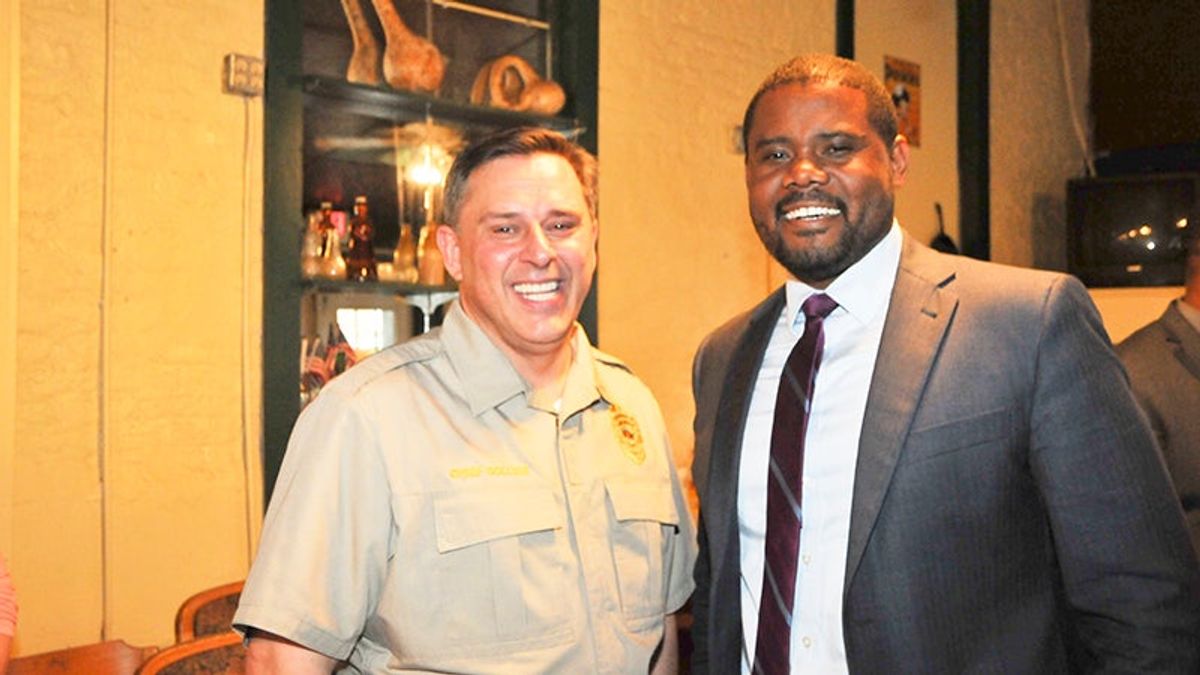 Law enforcement officers from multiple departments appreciat...