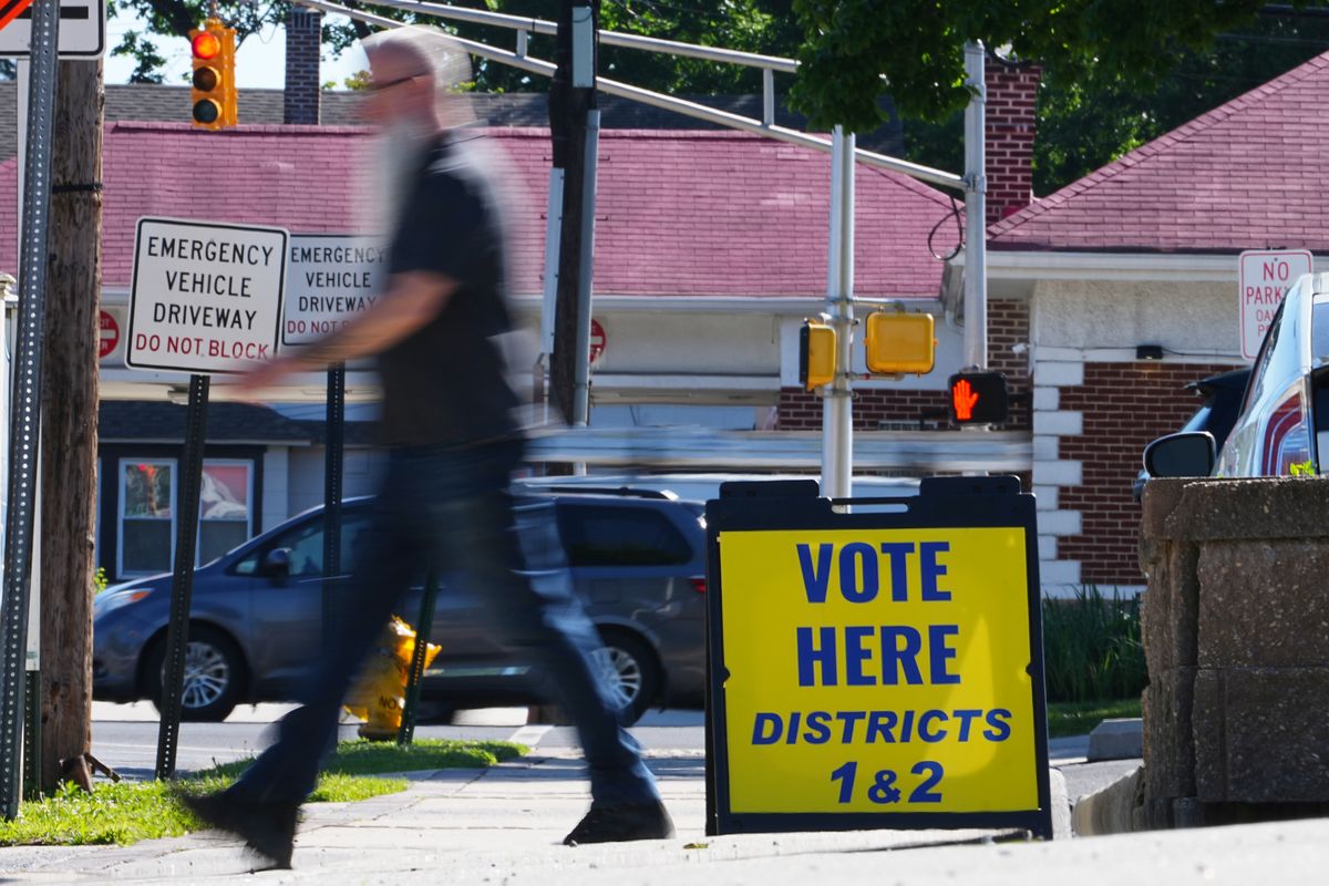 The Latest: Polls open for races across the US as a busy pri...