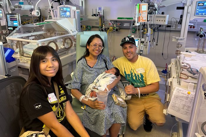 'The best gift ever': Baby is born after the rarest of pregnancies, de...