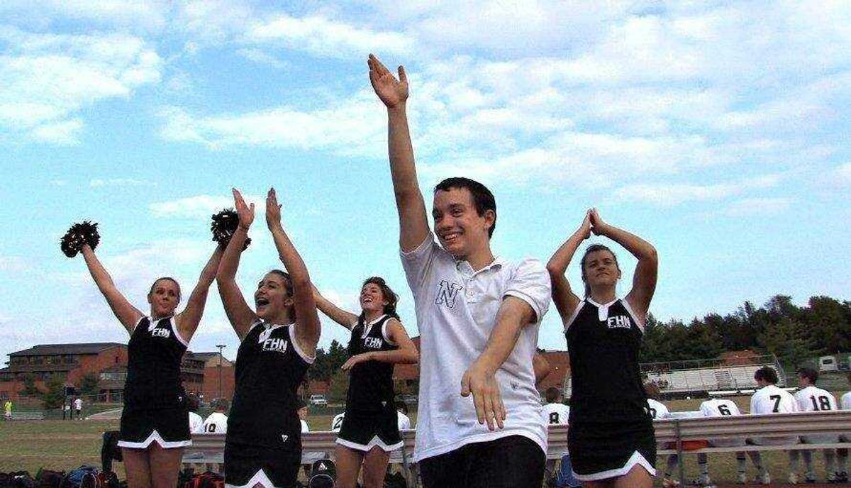 Deaf students join Francis Howell North Hich School cheerlea...