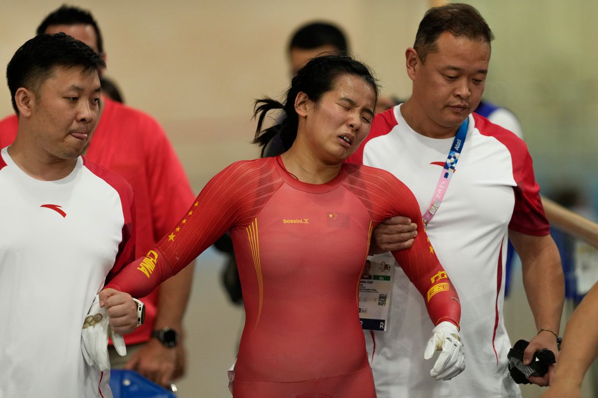 China track cyclist Yuan Liying has to be helped off velodrome after c...