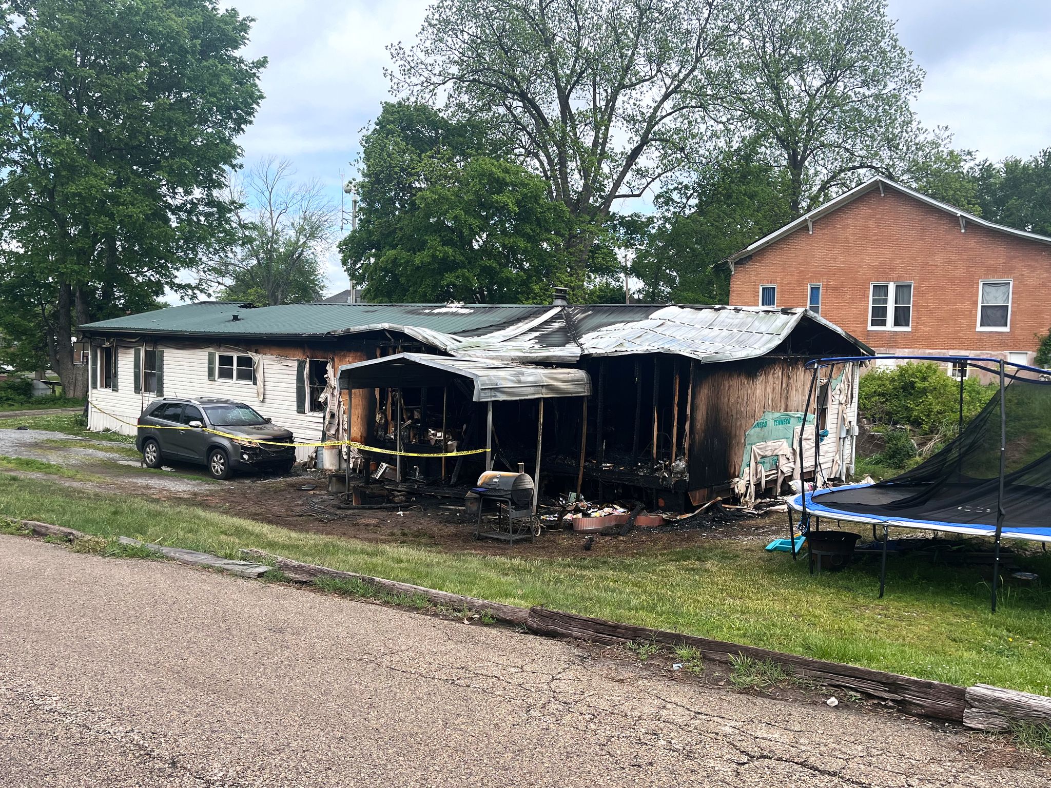 Fatal Scott City mobile home fire leaves two dead; child sav...