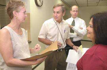 Election officials recount ballots