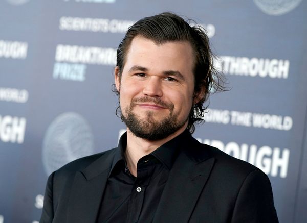 Chess grandmaster Magnus Carlsen returns to a tournament after a dispu...