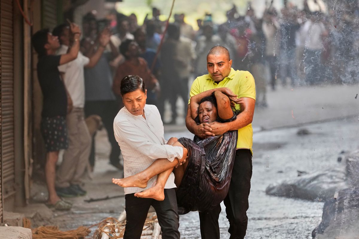 Photos show rescue efforts and aftermath of New Delhi buildi...