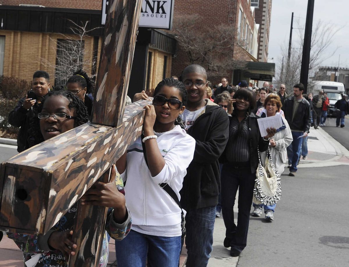 Nearly 200 gather for downtown cross walk on Good Friday