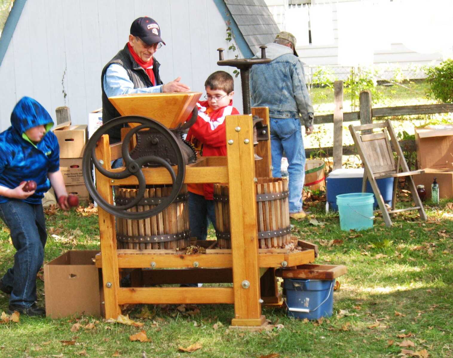 Logan at the Apple Cider Press - Heritage Days