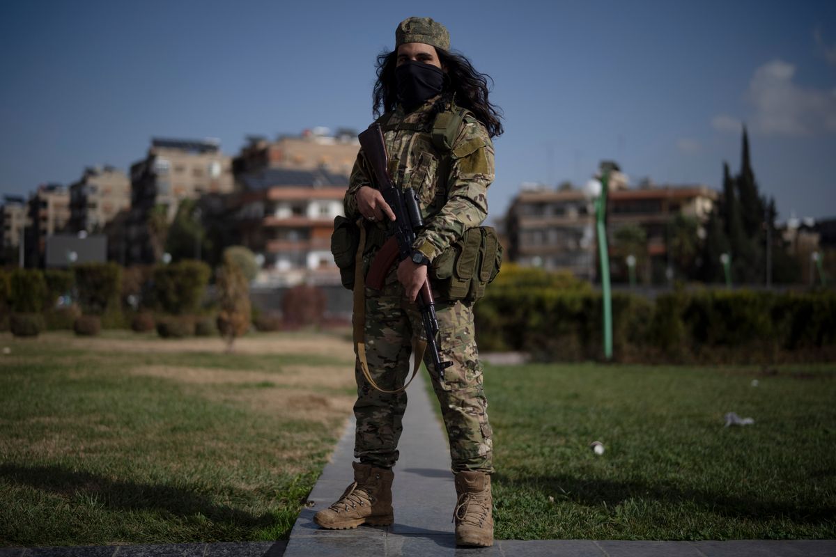 AP PHOTOS: Portraits of former Syrian rebels now soldiers
