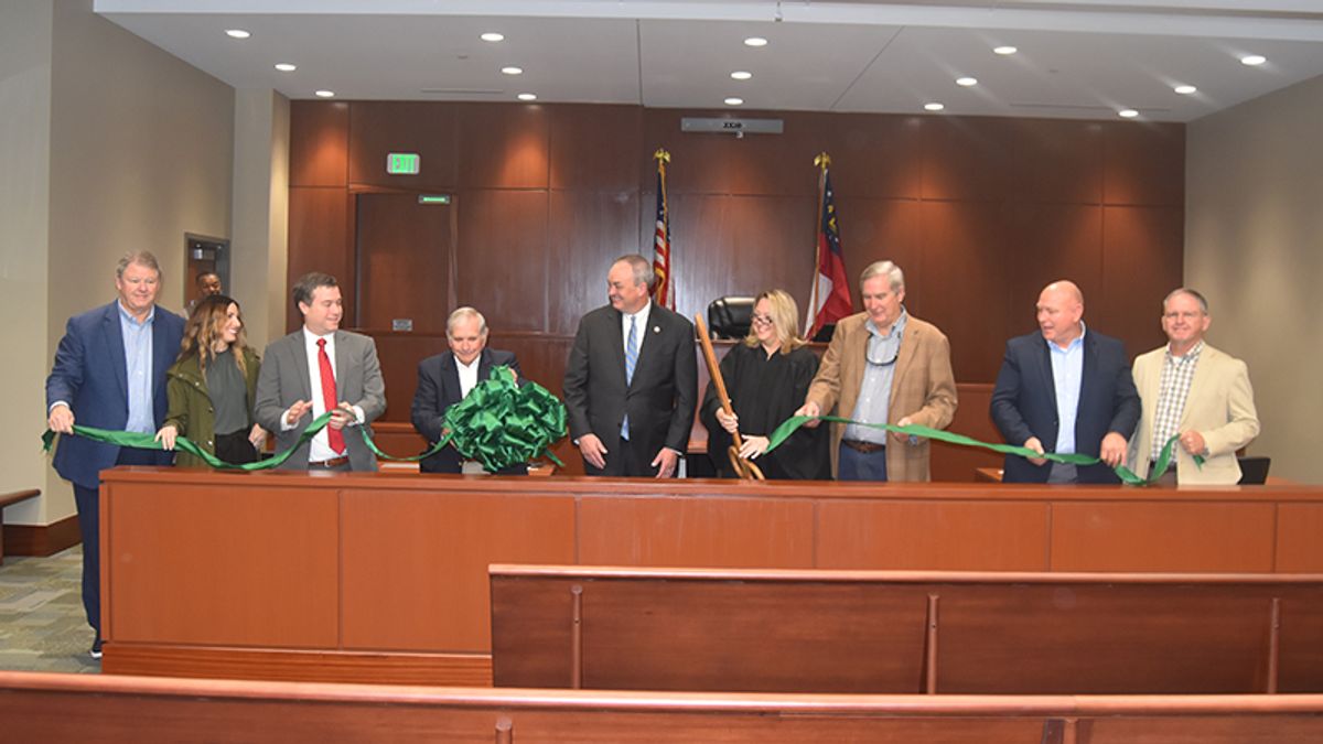 ALL RISE: Troup cuts the ribbon on new courtroom