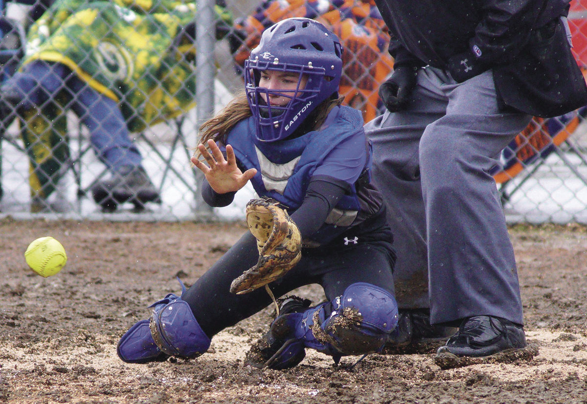 Cardinals slip, slide through mud, beat Pullman in softball