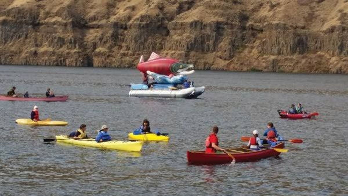 Large flotilla takes message to the water