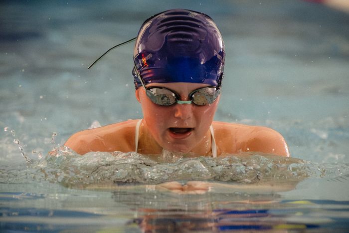 Pack women second, boys third in New Bern swim meet