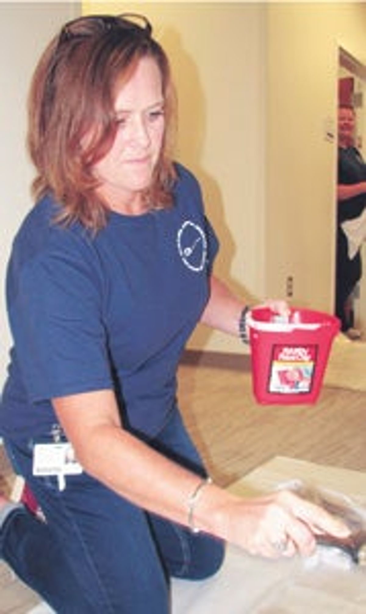 Sentara volunteers paint at clinic