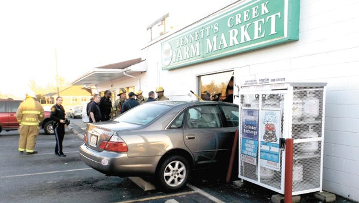 Car hits farm market