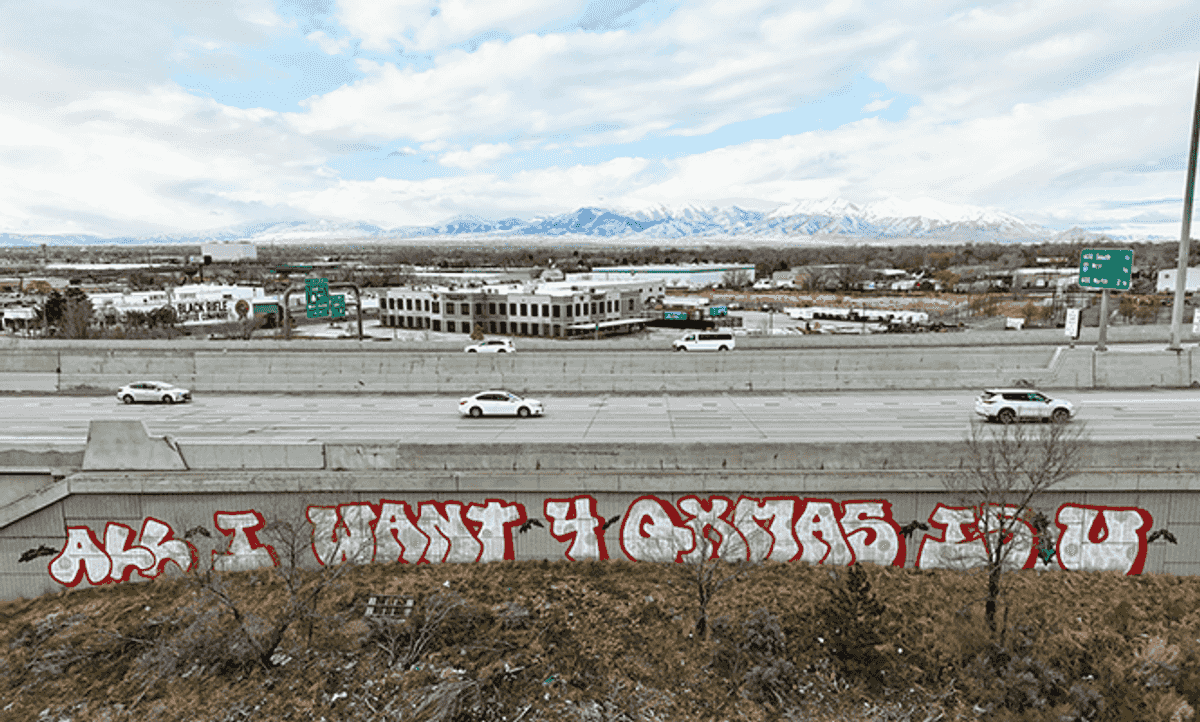 Annual holiday-themed graffiti brightens up a drab freeway overpass in...