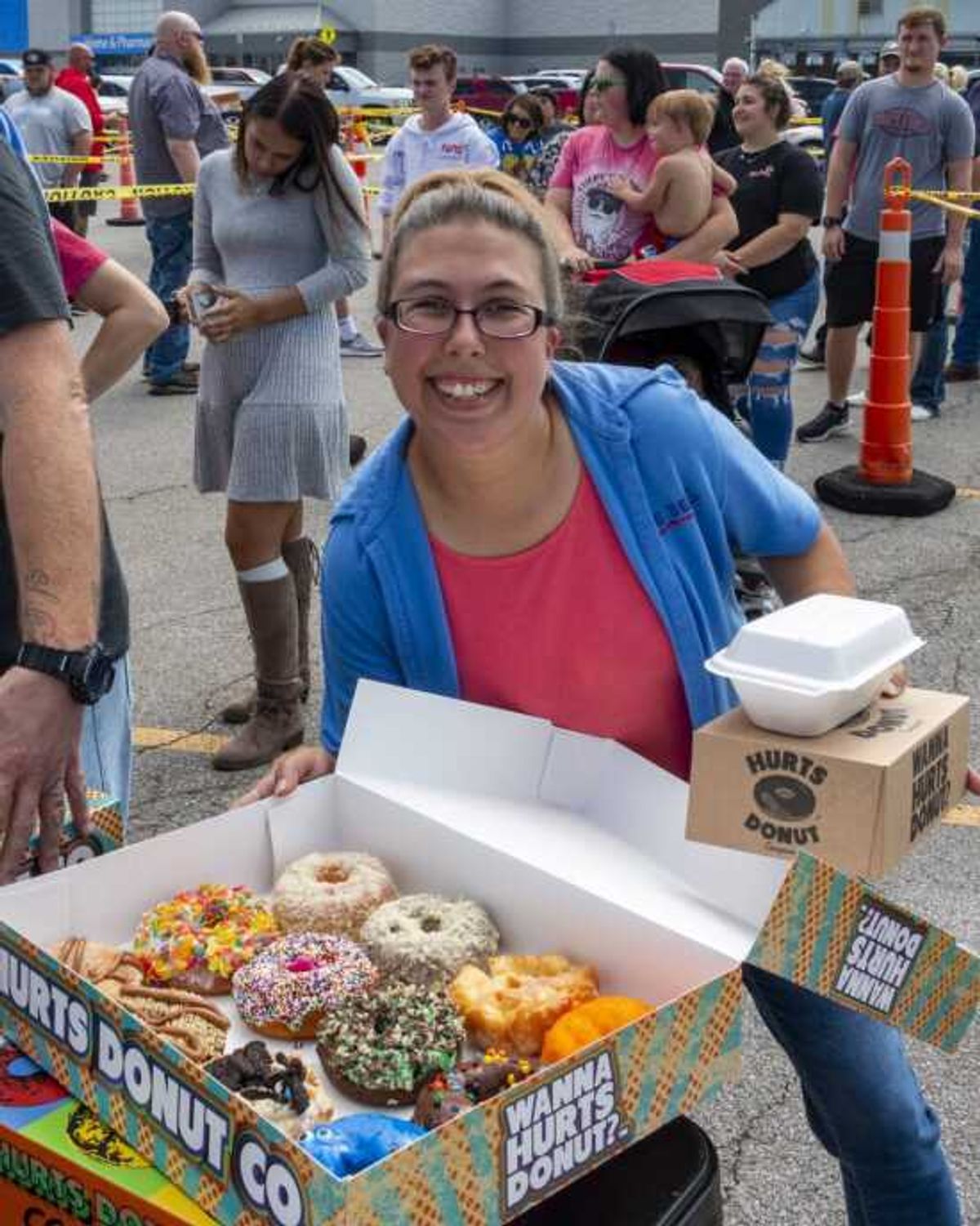 Community members line up for donuts and to support Children's Miracle...